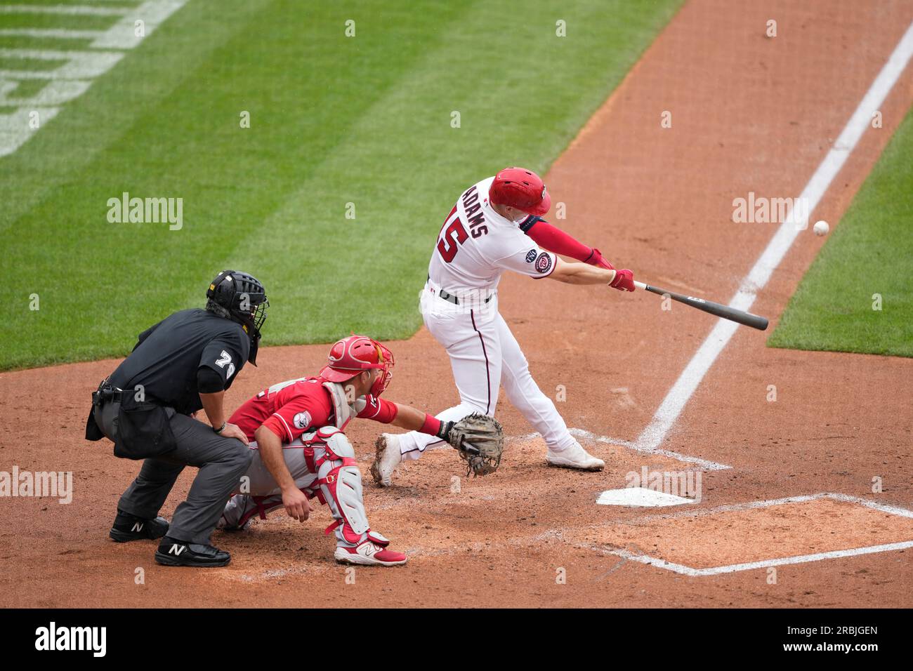 Washington Nationals' Riley Adams swings during an at-bat in front of ...