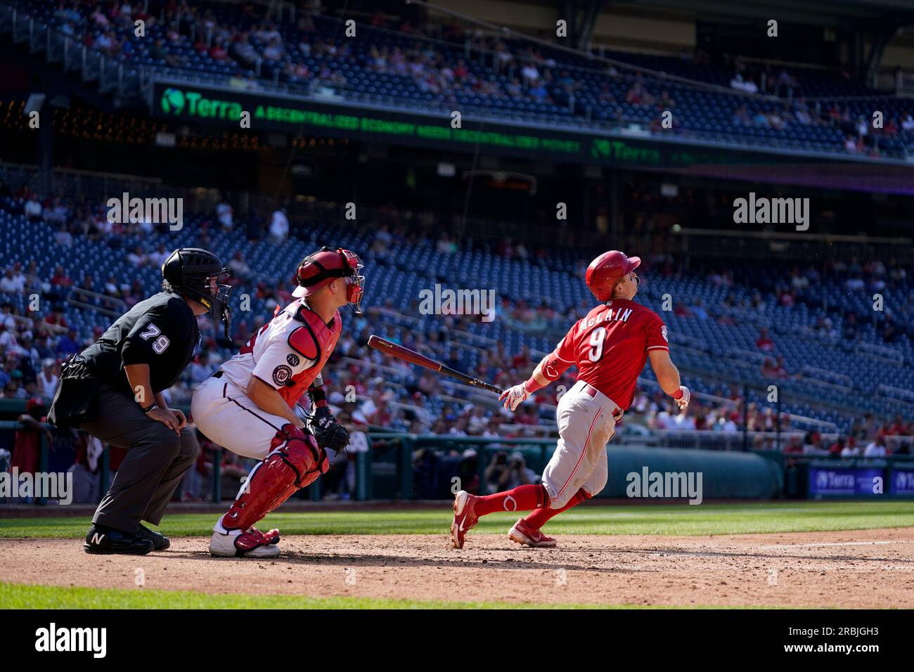 Cincinnati Reds' Matt McLain swings during an at-bat in front of ...