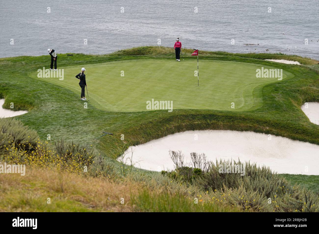 Hyo Joo Kim, of South Korea, left, putts on the seventh Green during the second round of the U.S ...