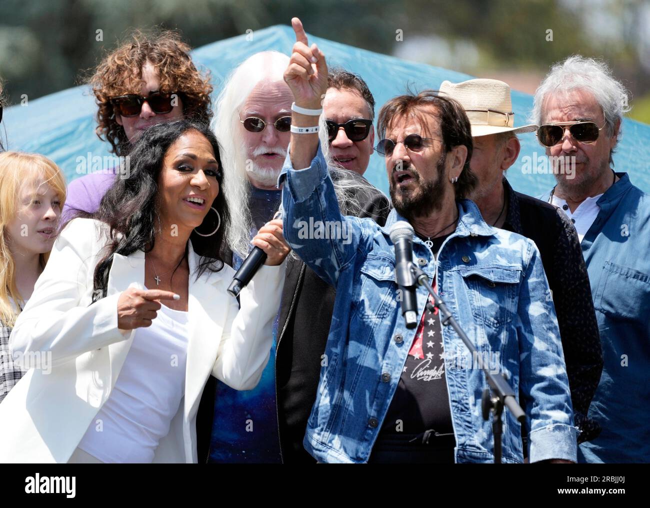 Ringo Starr, right, is joined onstage by Sheila E. during his Peace and ...