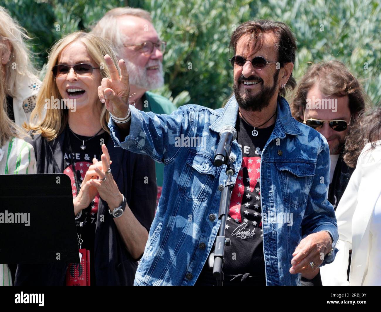 Ringo Starr and his wife Barbara Bach look out to the audience during ...