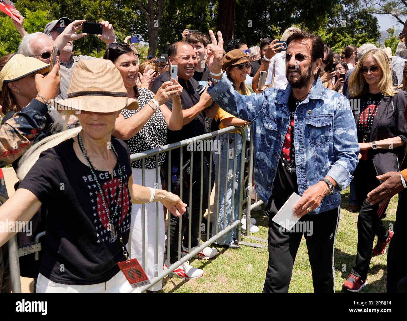Ringo Starr waves to fans outside his Peace and Love Birthday ...