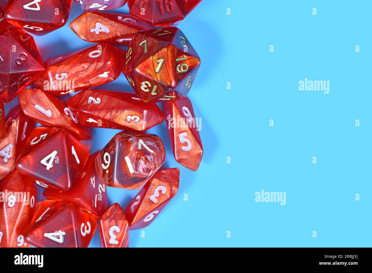 Roleplay game background with different red RPG dices at side of light ...