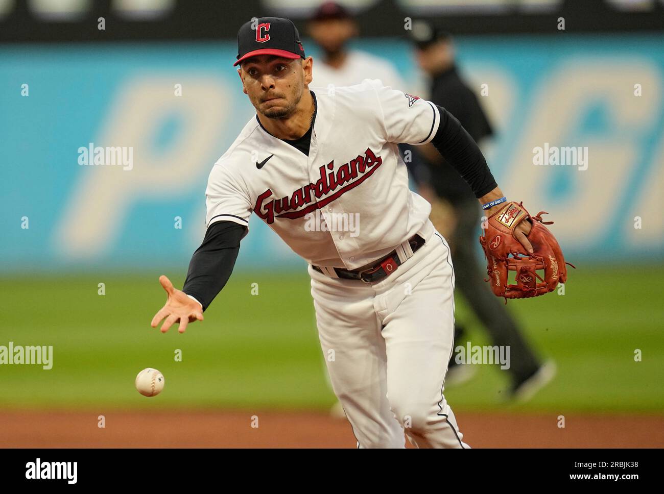 Cleveland Guardians second baseman Andres Gimenez tosses the ball to ...