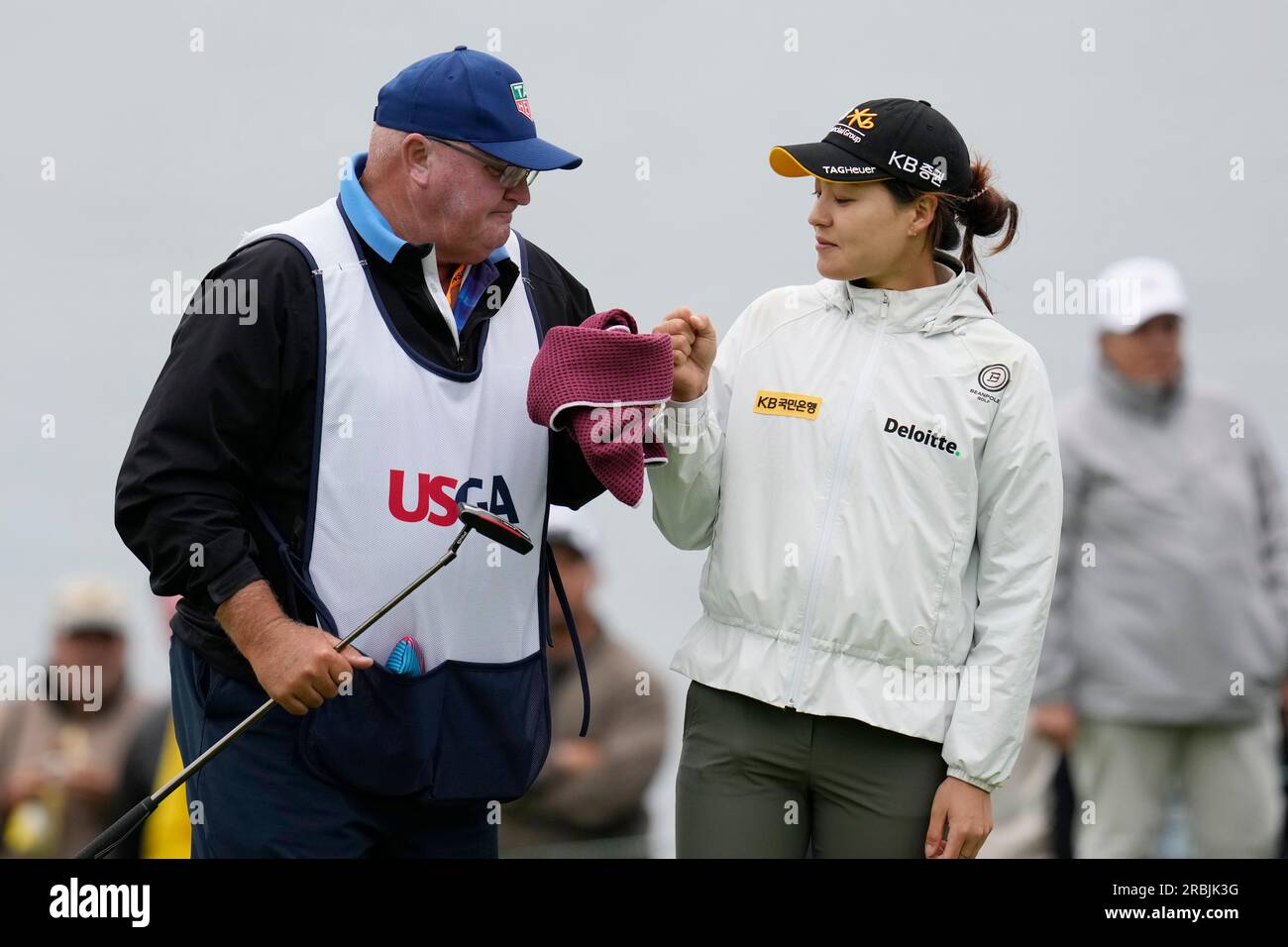 In Gee Chun bumps fists with her caddie on the 14th green during the ...