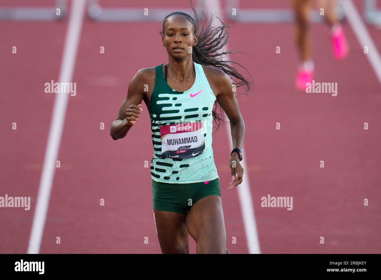 Dalilah Muhammad competes in the first round of the women's 400 meter ...