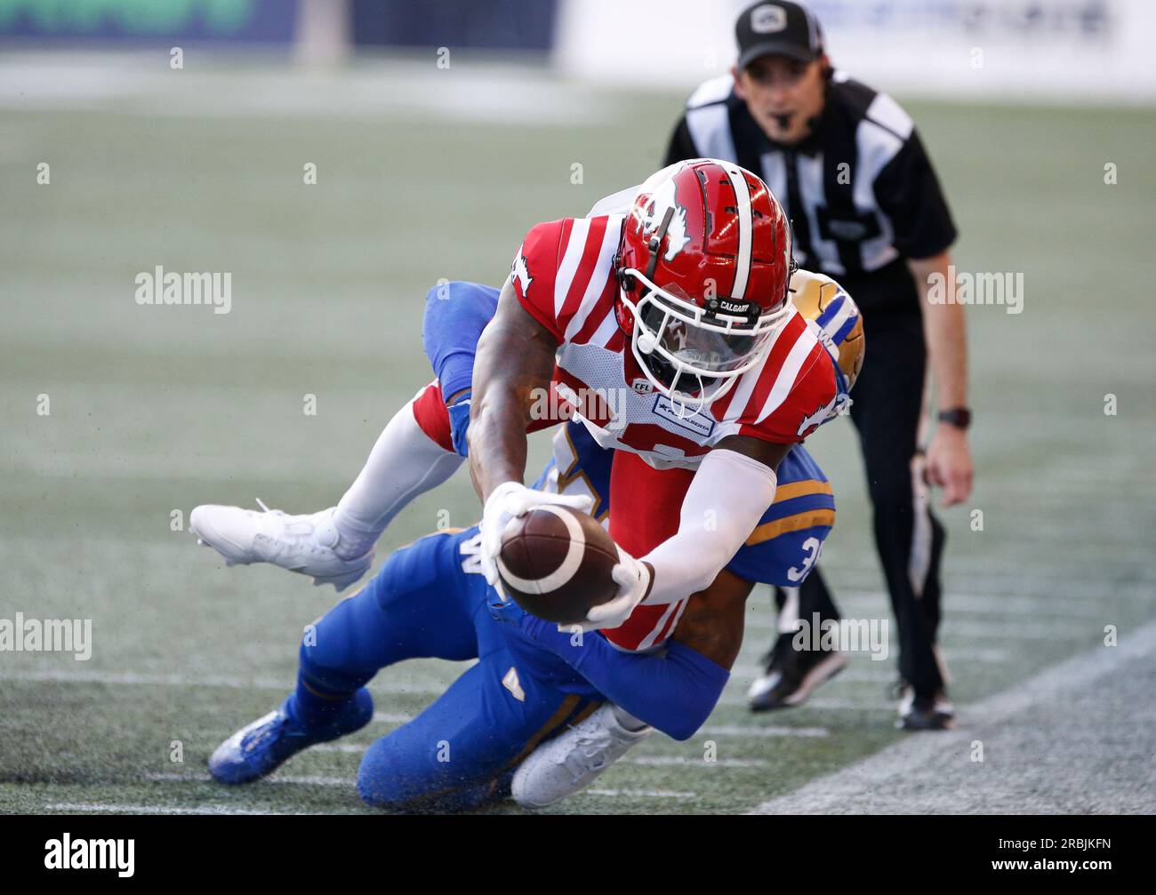 Winnipeg Blue Bombers' Demerio Houston (35) tackles Calgary Stampeders ...