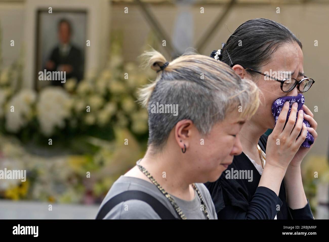 People react after offering prayer for former Prime Minister Shinzo Abe ...
