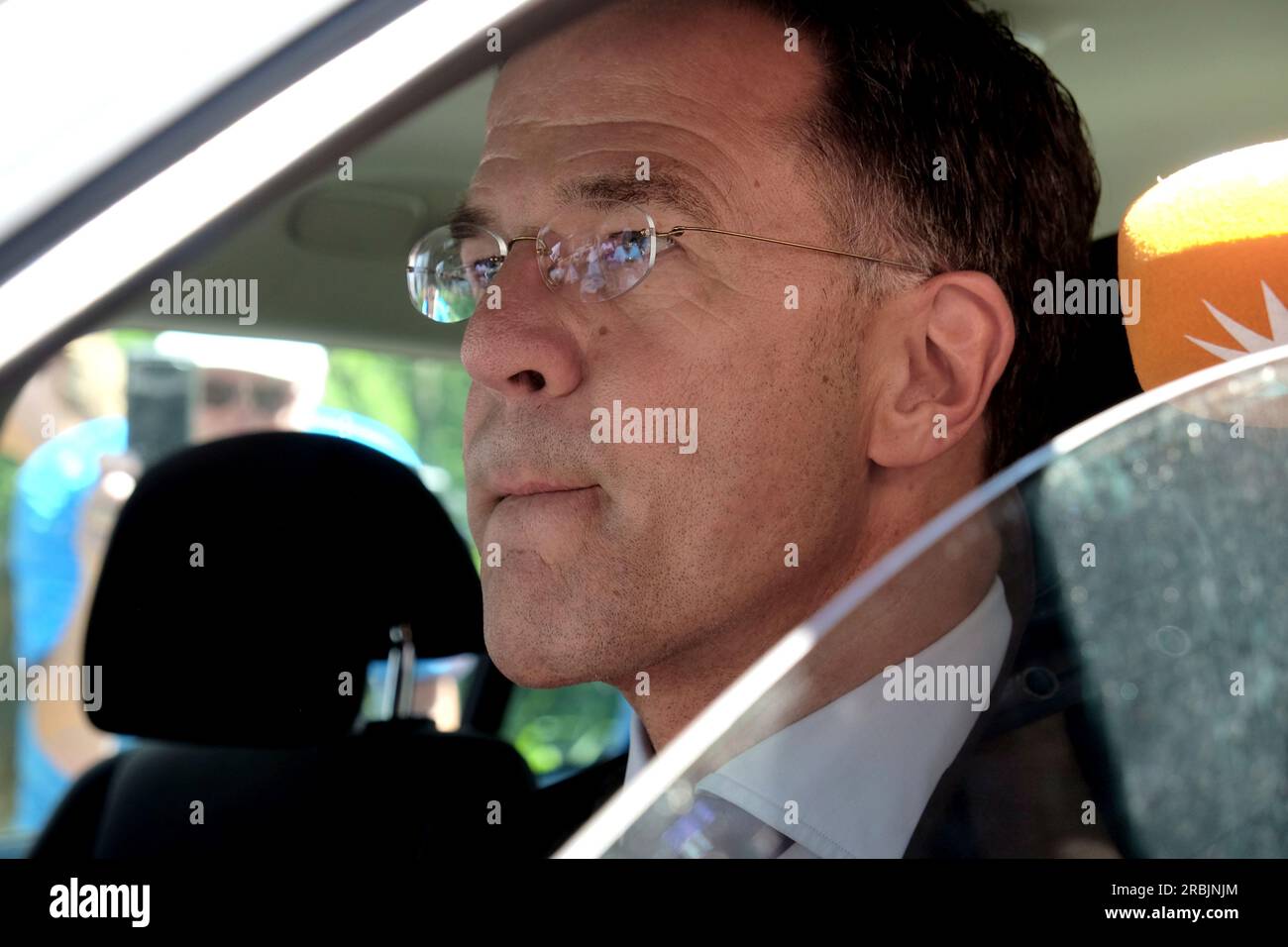 Dutch Prime Minister Mark Rutte sits in a car as he leaves Palace Huis ...