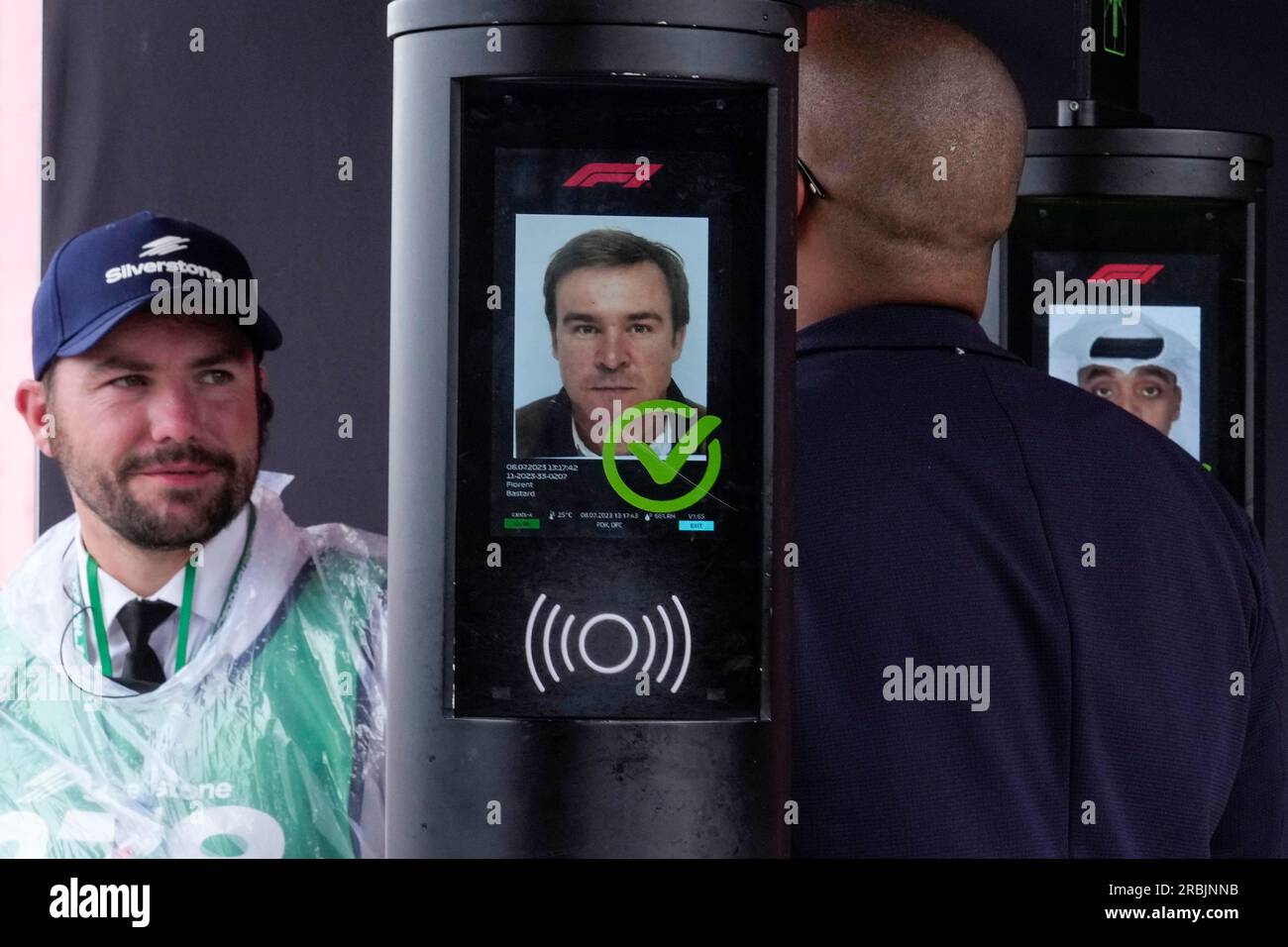 Security personnel stand at a gate to the paddock after the third free ...