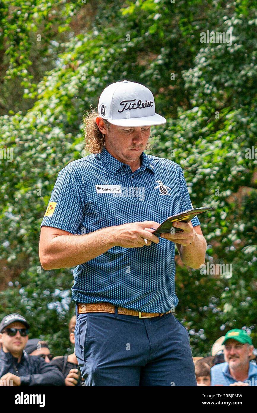 Captain Cameron Smith of Ripper GC checks his yardage book on the ...