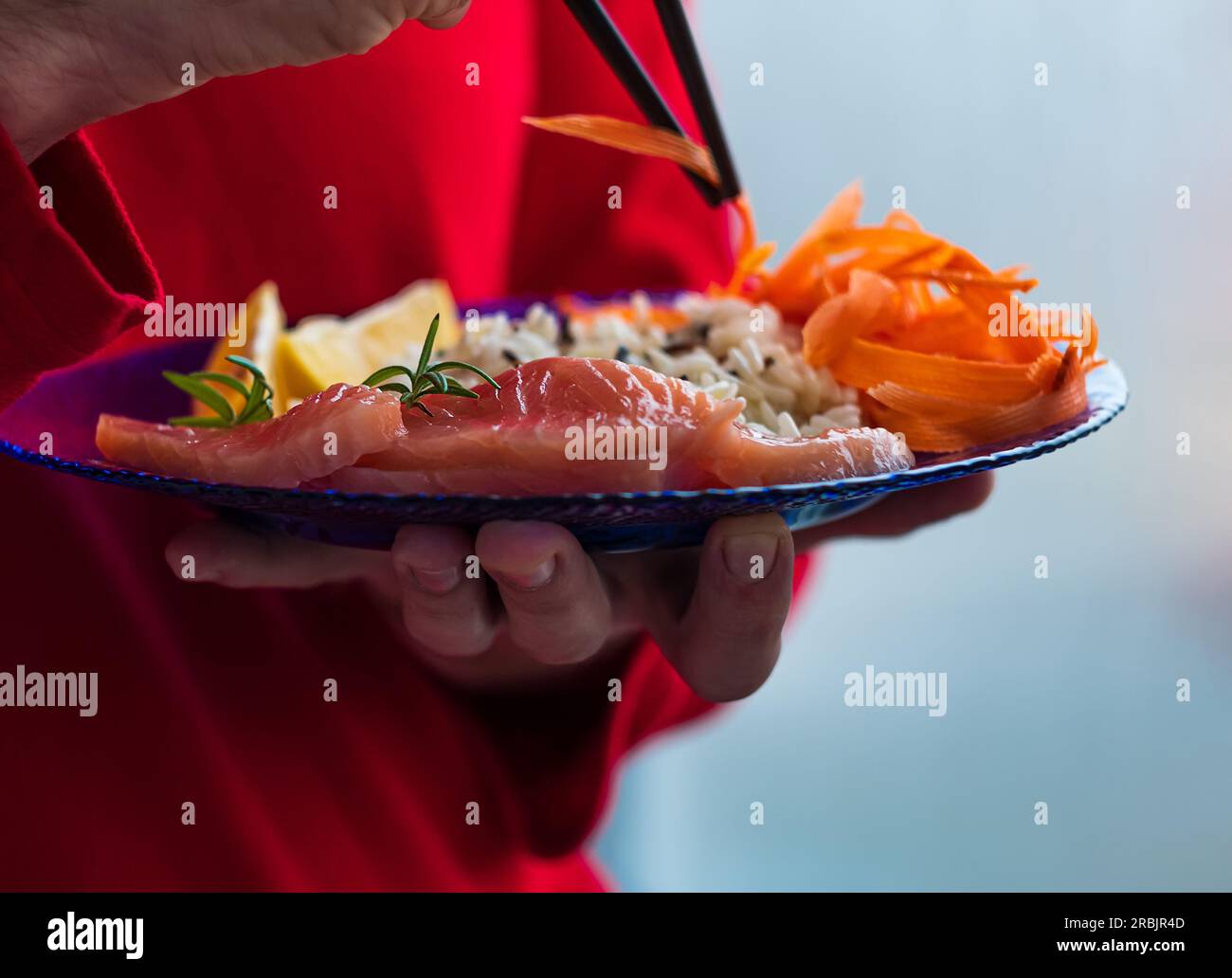 Healthy food balanced meal with salmon wild rice carrots lemon slices ...