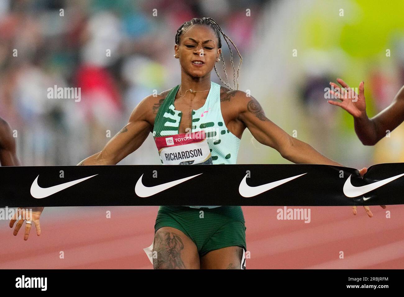 Sha'Carri Richardson crosses the line ahead of Brittany Brown, who took ...