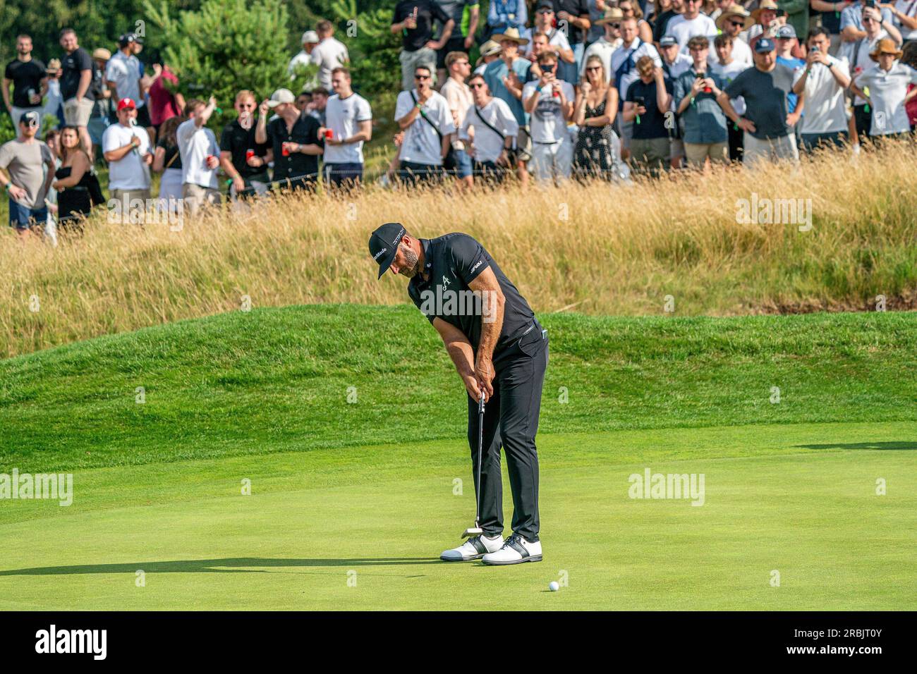 Captain Dustin Johnson of 4Aces GC putts on the 17th greem during the ...