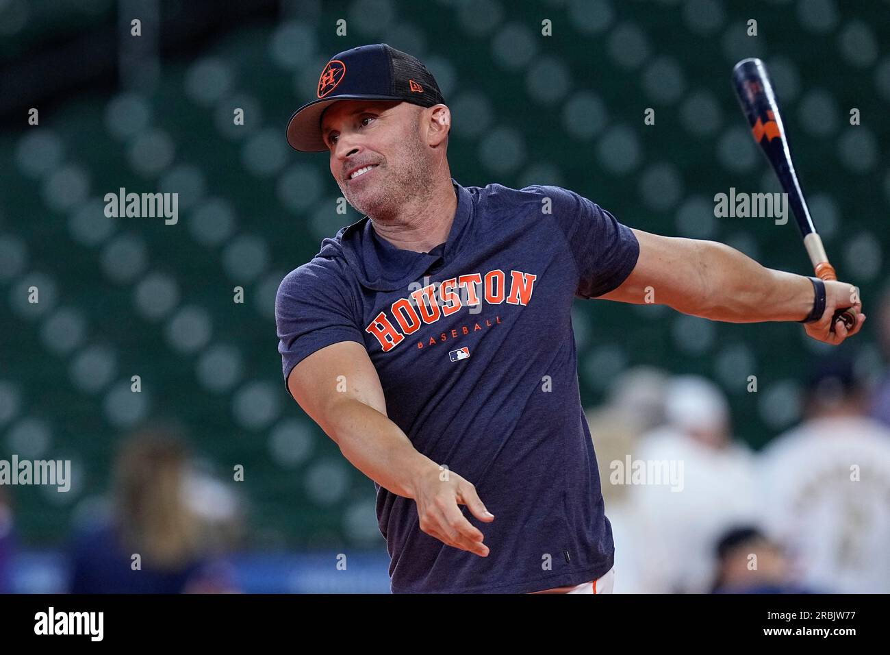 Houston Astros bench coach Joe Espada hits infield practice before a ...