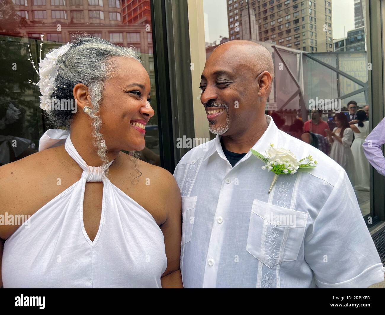 Hazel Seivwright-Carney and her husband, Rohan Carney, smile at one ...