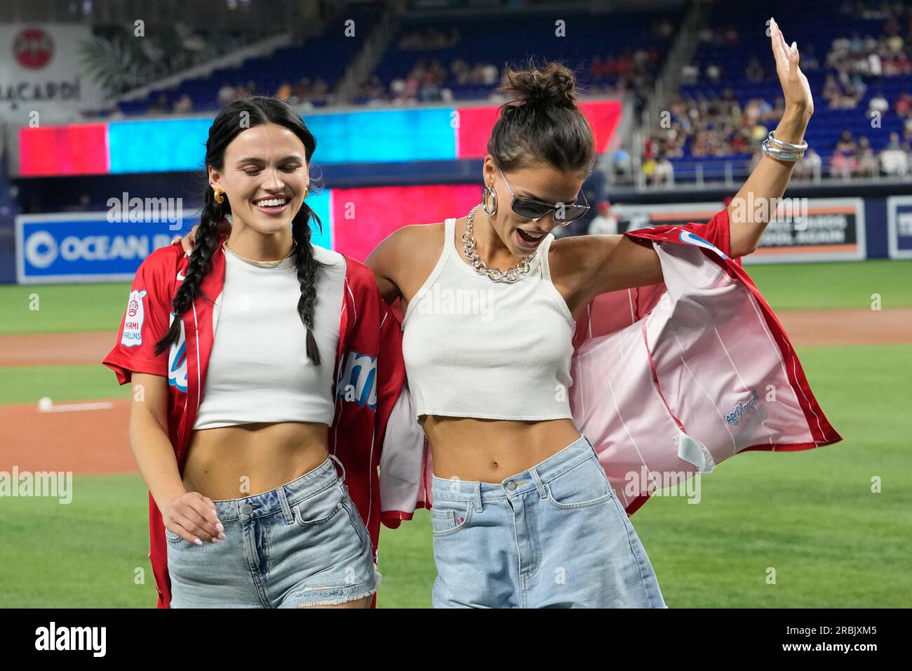 Sports Illustrated swimsuit cover model Brooks Nader, right, stands on ...