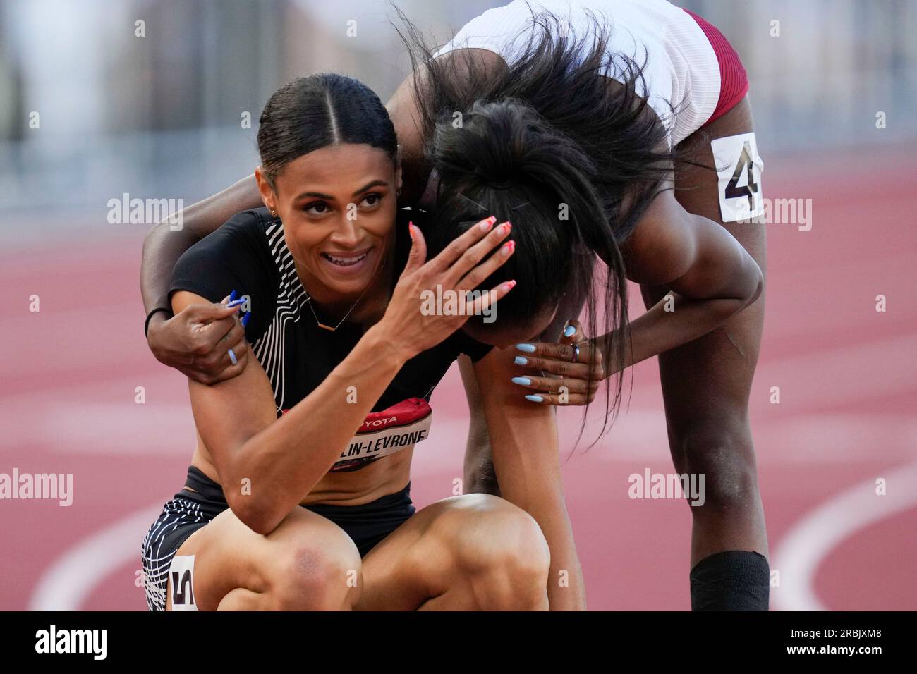 Sydney McLaughlin-Levrone is congratulated by second place finisher ...