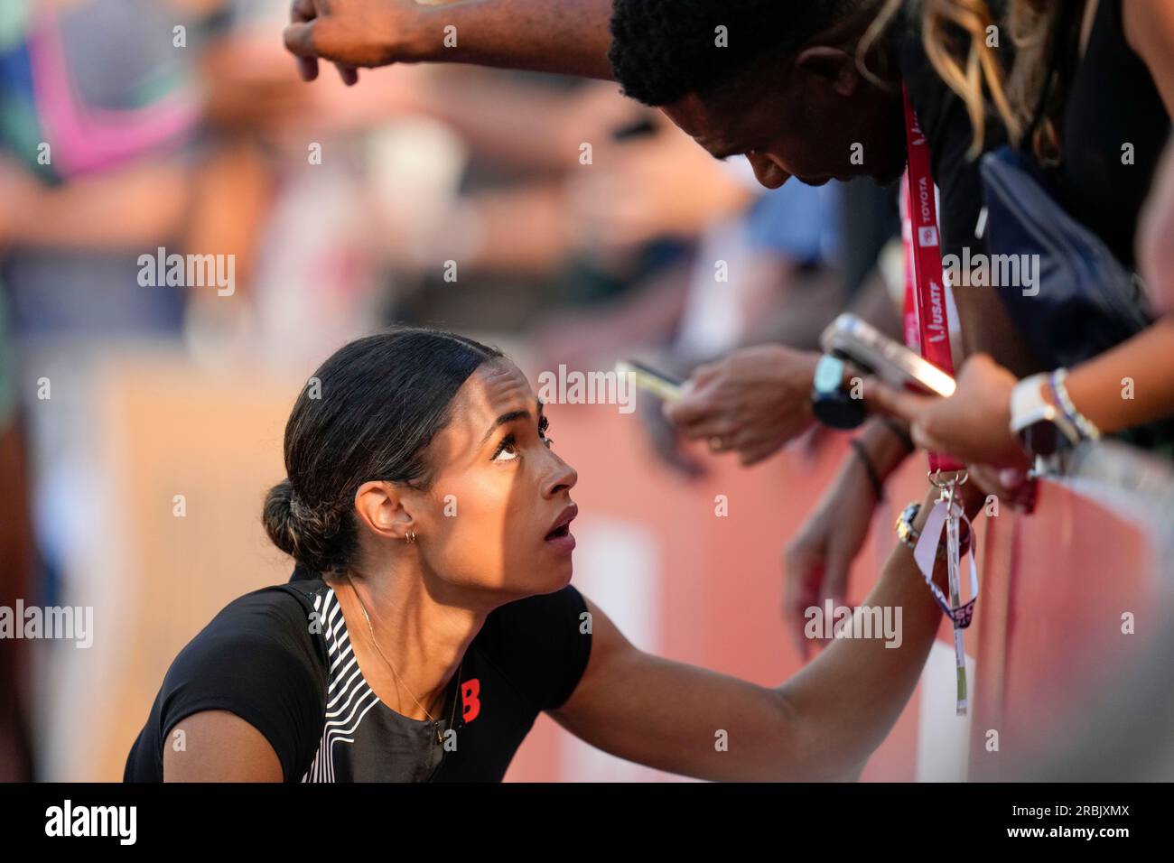 Sydney McLaughlin-Levrone talks to people in the stands after winning ...