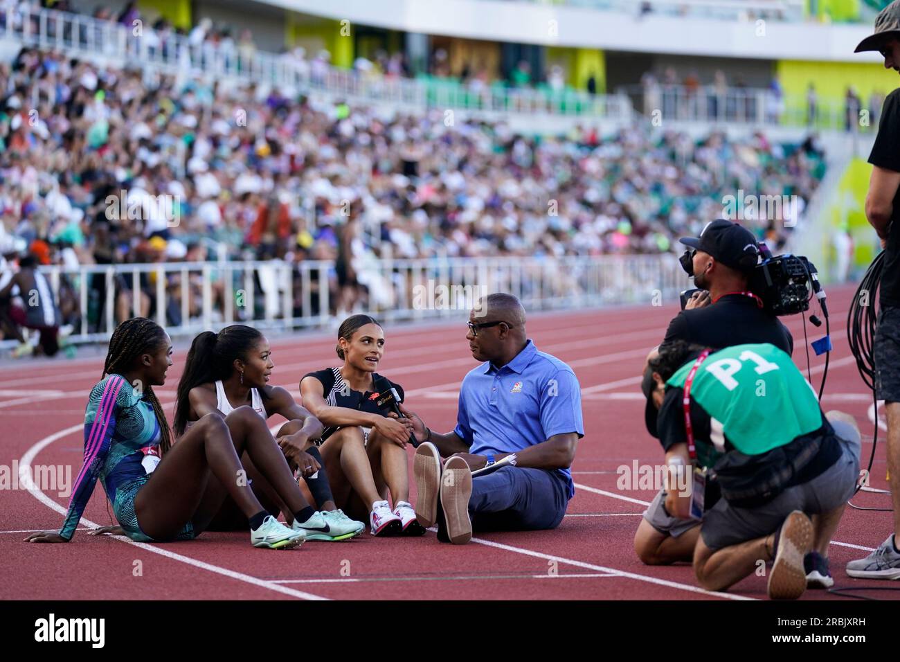 The three top finishers in the women's 400 meters are interviewed after ...