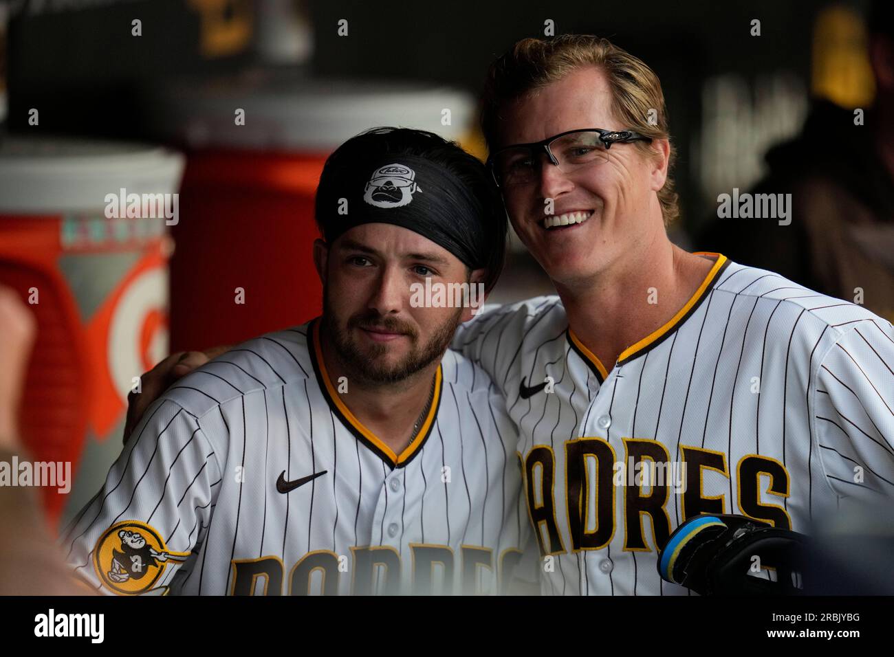 San Diego Padres' Matthew Batten, left, poses in the dugout for a photo ...
