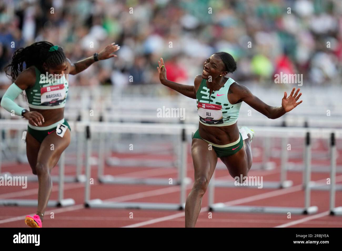 Nia Ali crosses the finish line to win the women's 100 meter hurdles ...