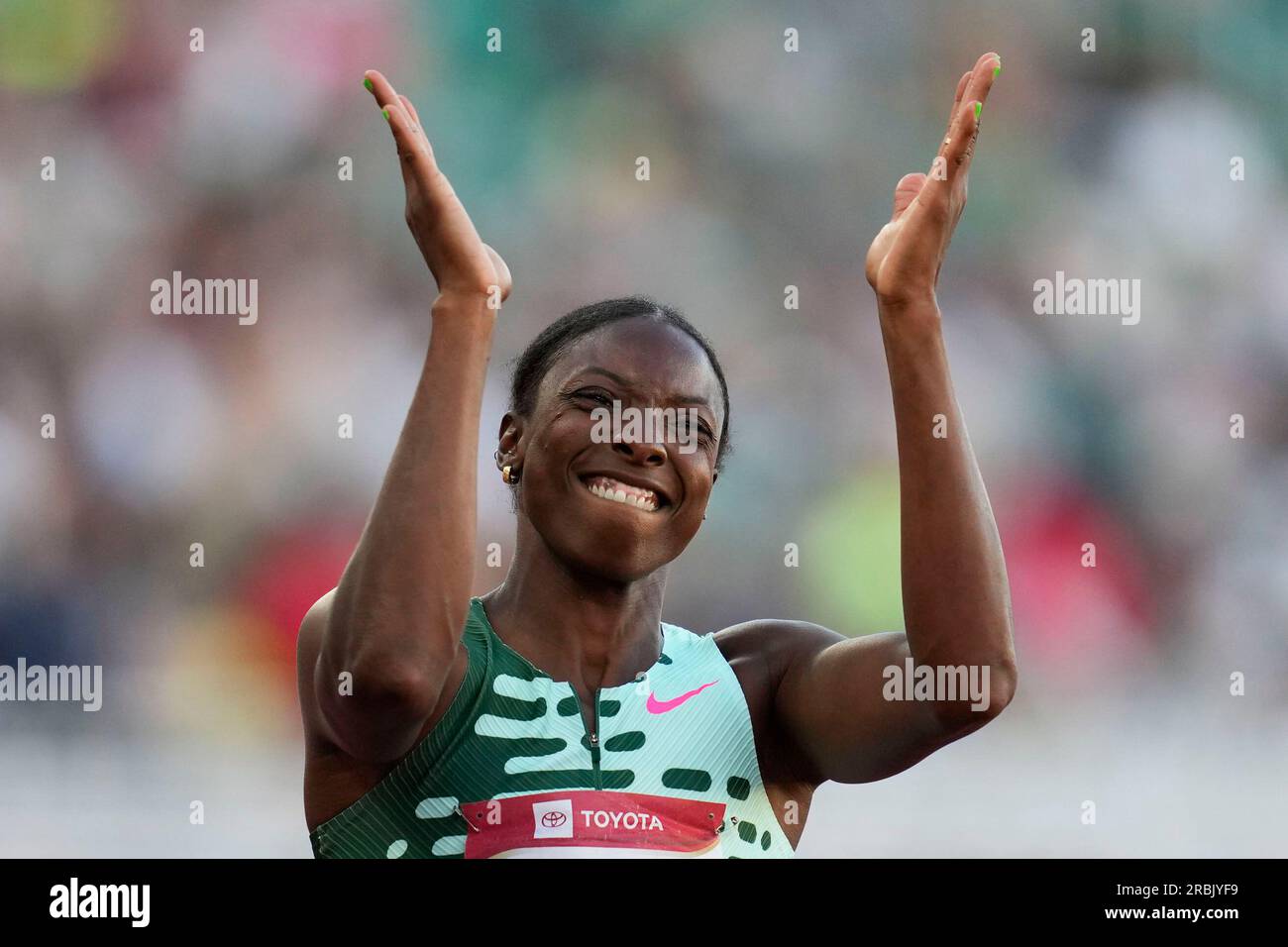 Nia Ali reacts after winning the women's 100 meter hurdles final during ...