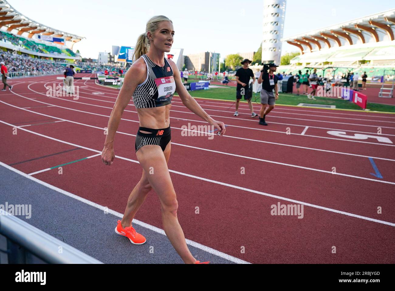 Second place finisher Emma Coburn walks on the track after the women's ...
