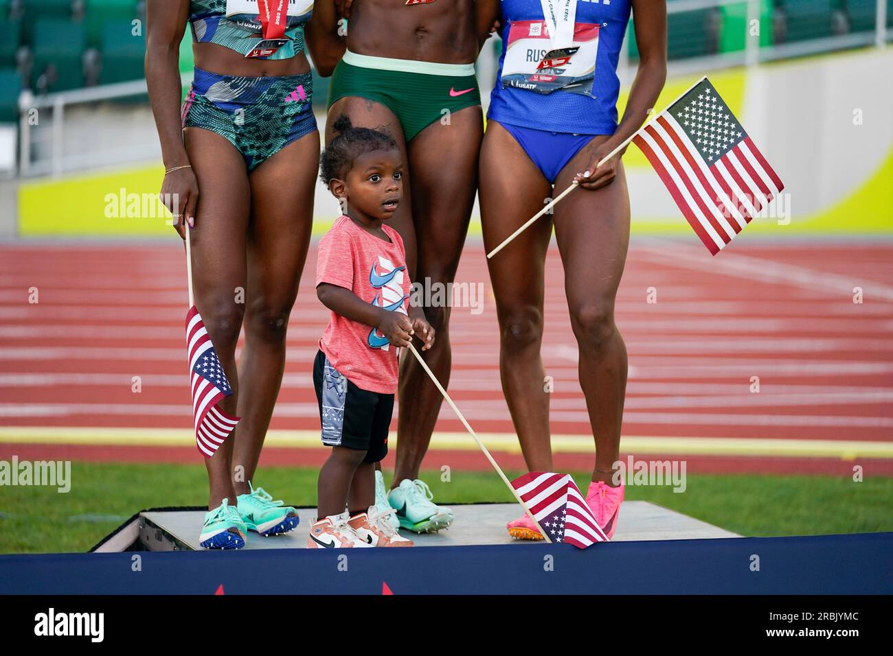 Nia Ali, center, silver medalist in the women's 3000 meter steeplechase ...