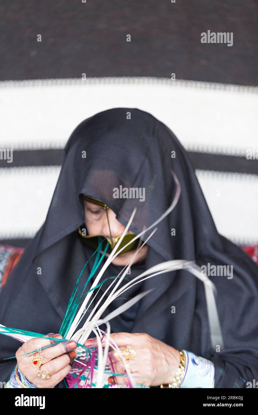 UAE, Dubai, local woman weaving Stock Photo - Alamy