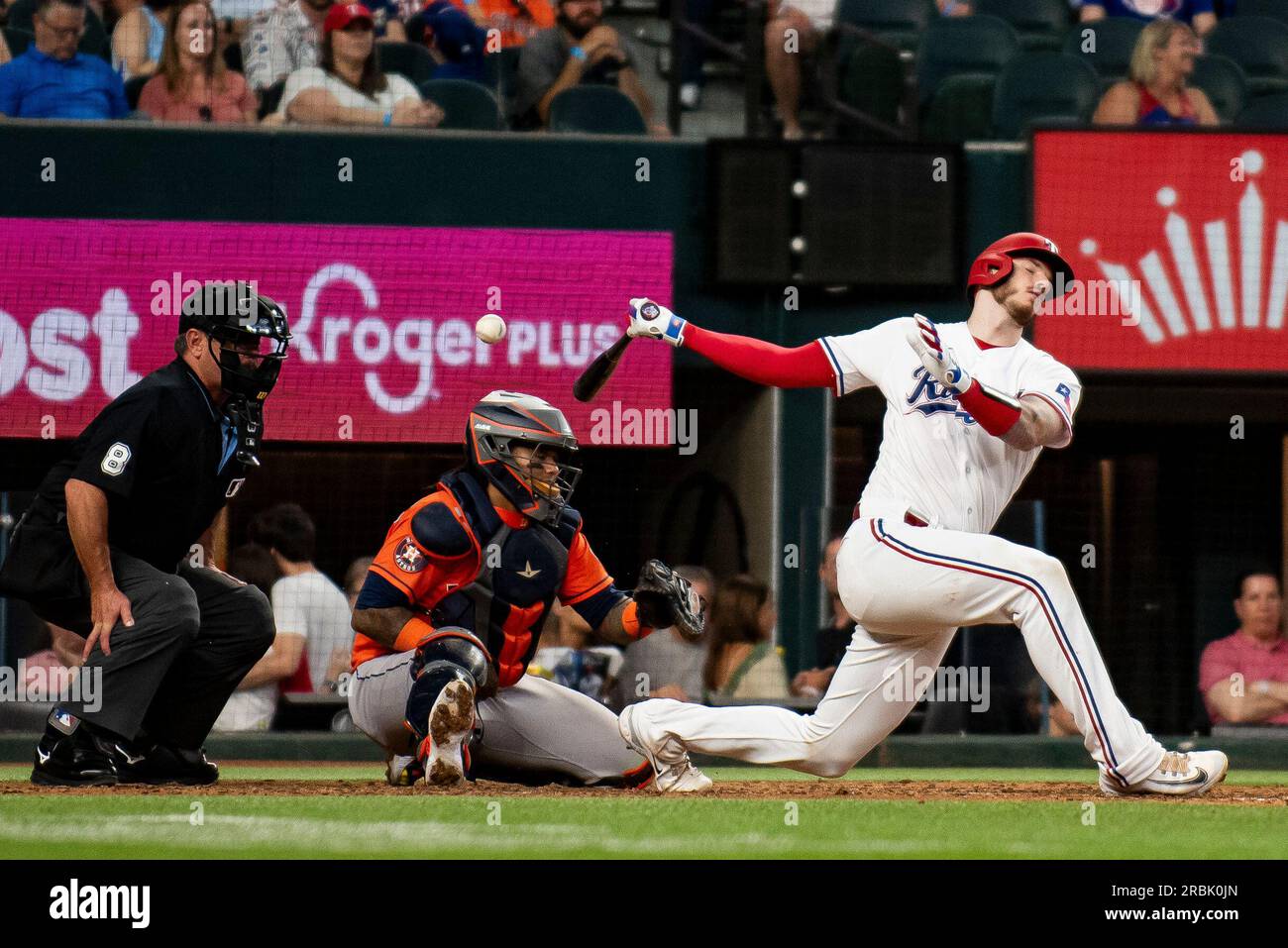 Texas Rangers catcher Jonah Heim (28) swings at a pitch in the bottom ...