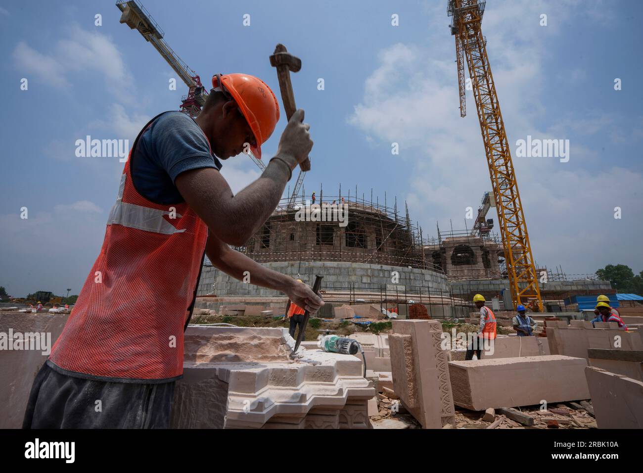 Workers are engaged in the construction of a temple of Hindu god Ram ...