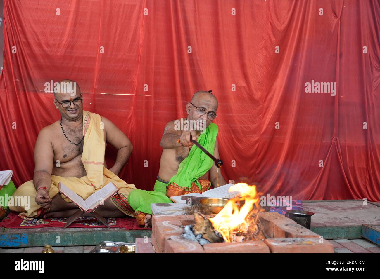 Hindu priests perform rituals at a makeshift temple of Hindu god Ram ...