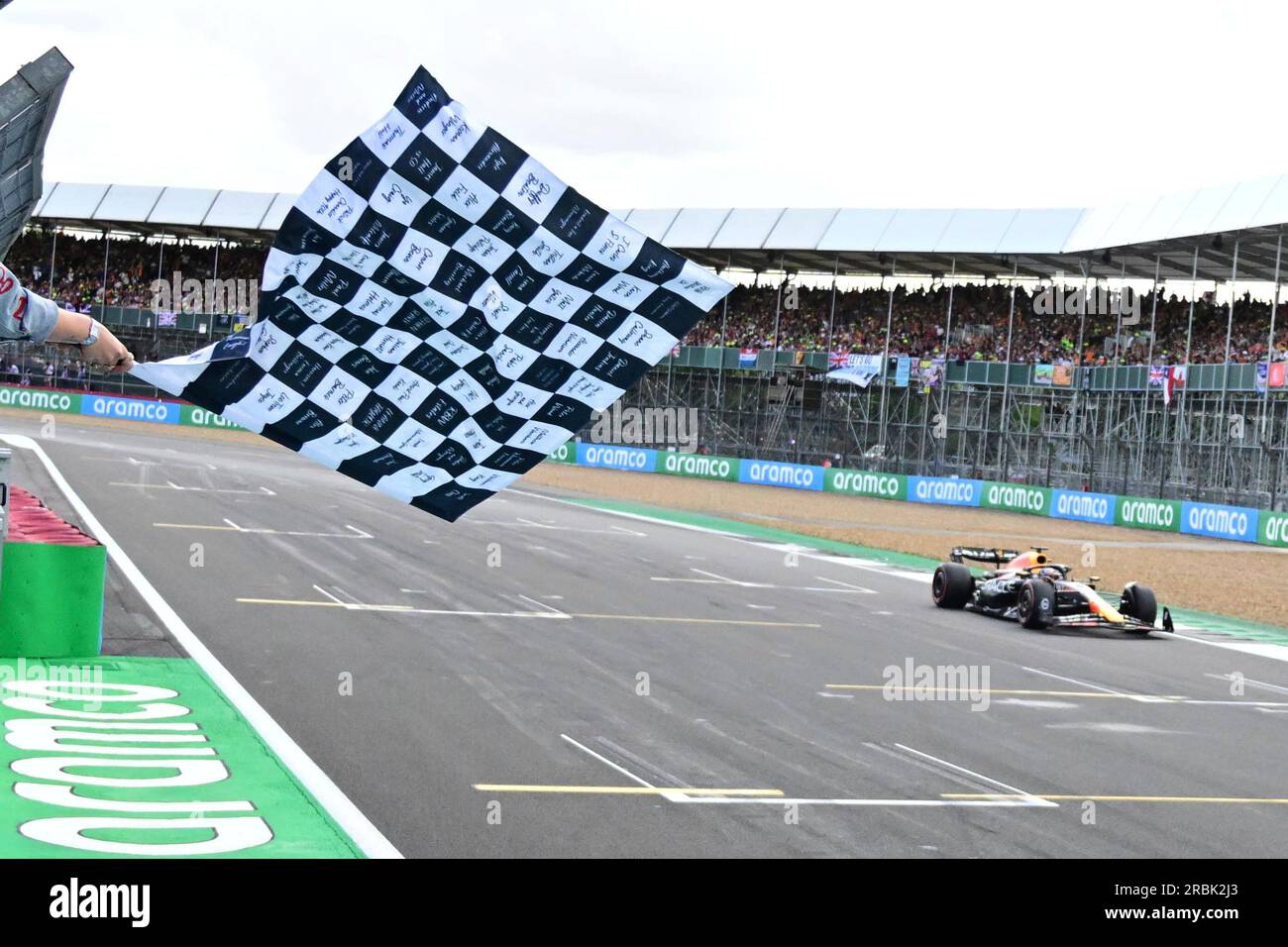 Red Bull driver Max Verstappen of the Netherlands crosses the finish ...