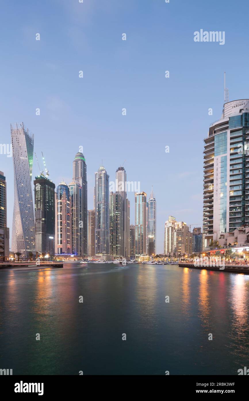 UAE, Dubai, city skyline with the iconic twisted "Cayman Tower" and ...