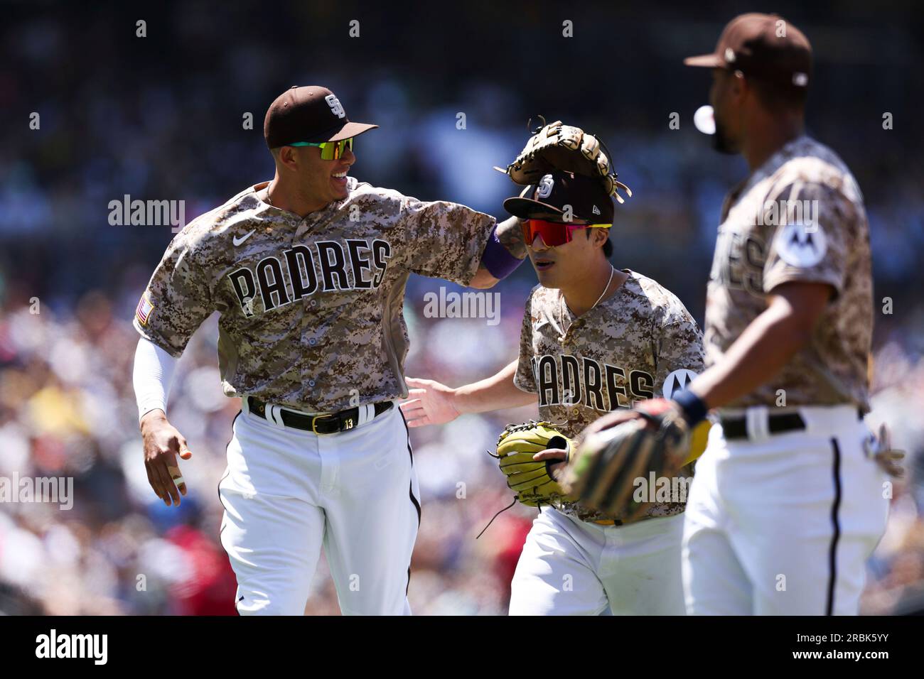 San Diego Padres' Manny Machado, left, celebrates with Ha-Seong Kim ...