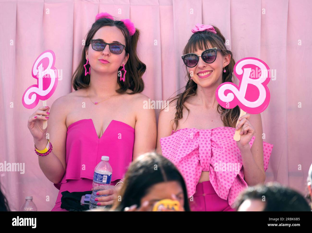People pose in the crowd prior to the premiere of "Barbie" on Sunday ...