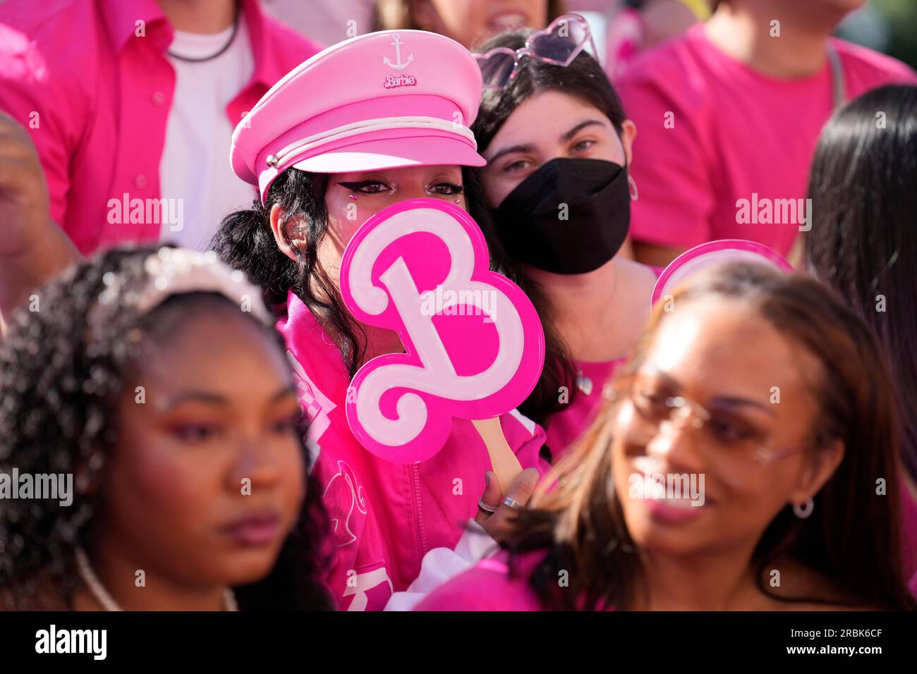 People pose in the crowd prior to the premiere of "Barbie" on Sunday ...