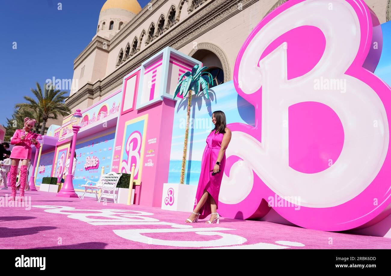 People pose on the red carpet at the premiere of "Barbie" on Sunday ...