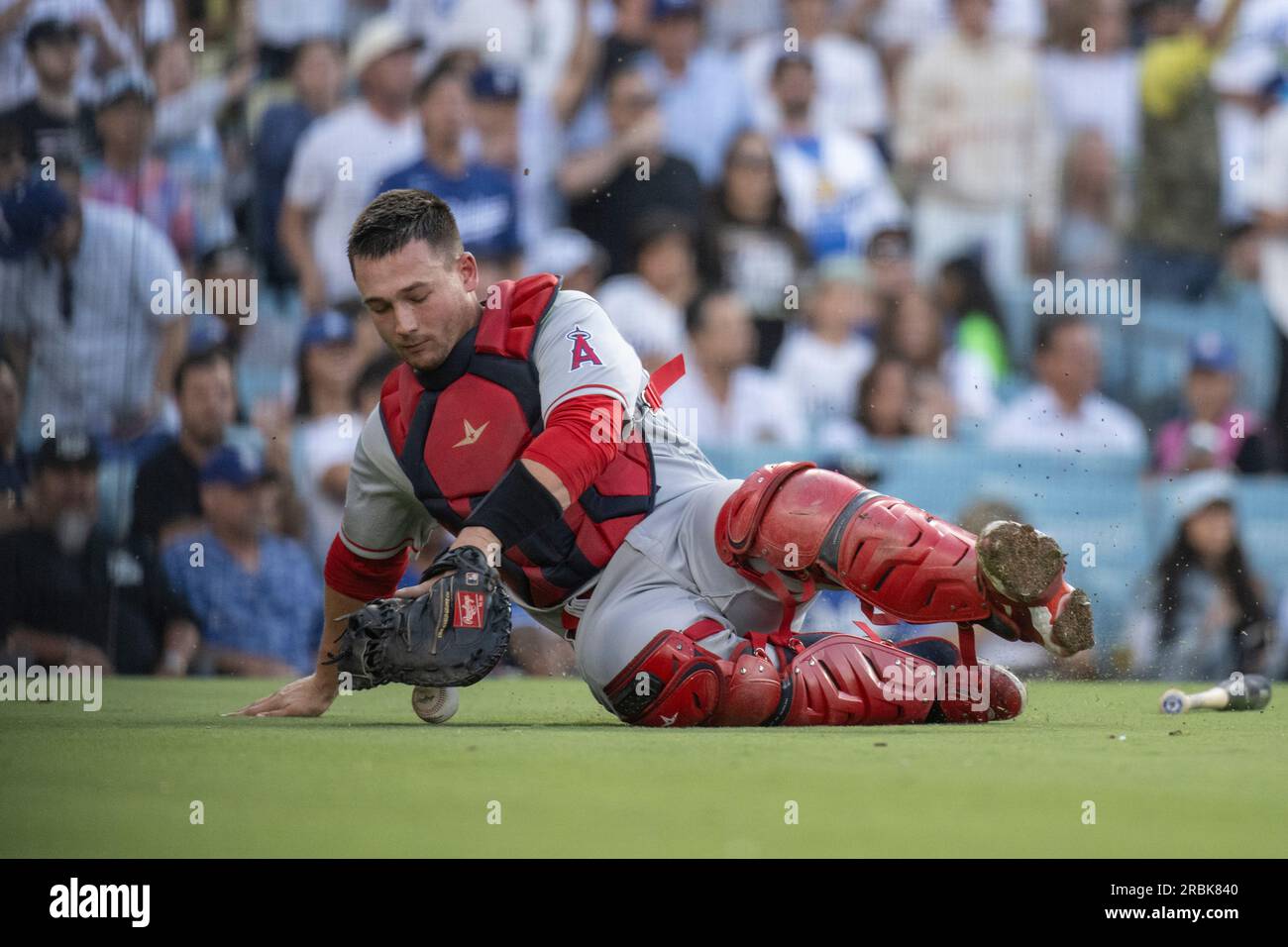 Los Angeles Angels catcher Matt Thaiss (21) slides to recover a throw ...