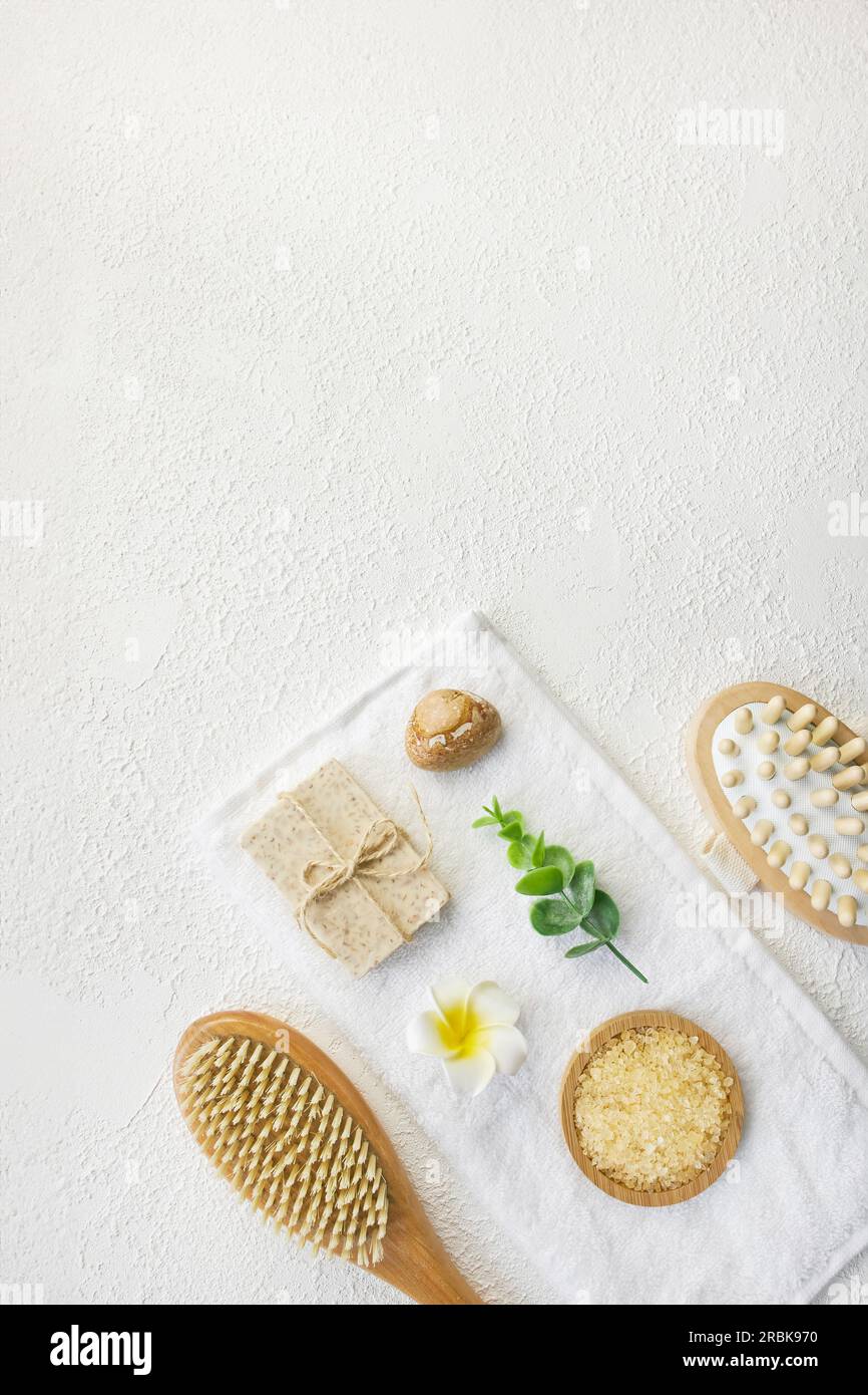 Cosmetic, massage and bath accessories set on white texture background ...