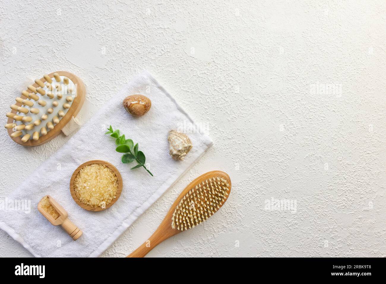 Cosmetic, massage and bath accessories set on white texture background ...