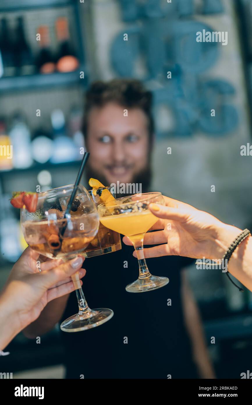 Friends Making A Toast In A Bar Stock Photo - Alamy