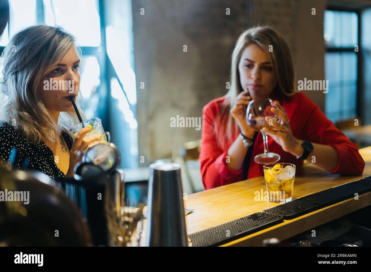 Two girls bar cocktail drink hi-res stock photography and images - Alamy