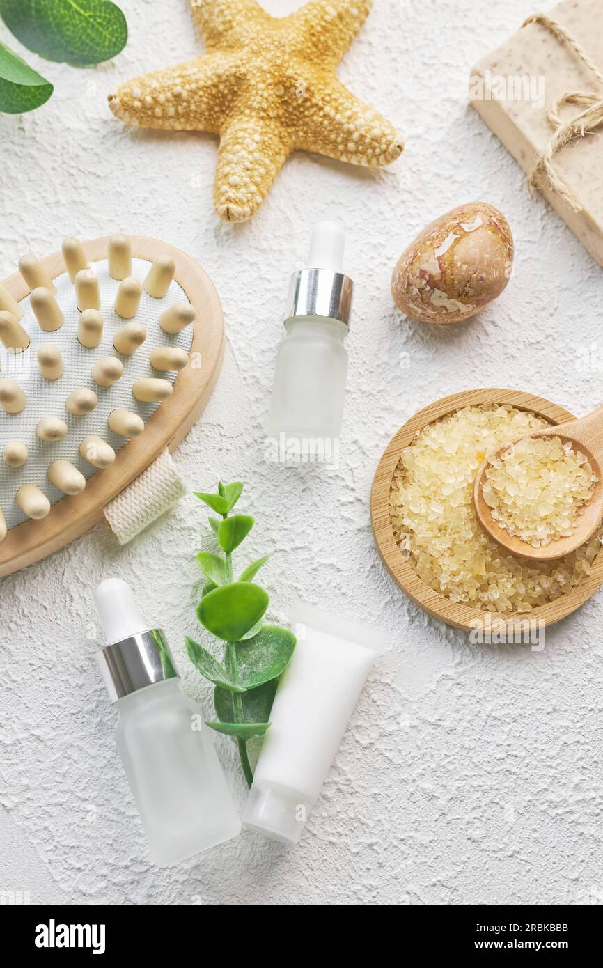 Cosmetic, massage and bath accessories set on white texture background ...
