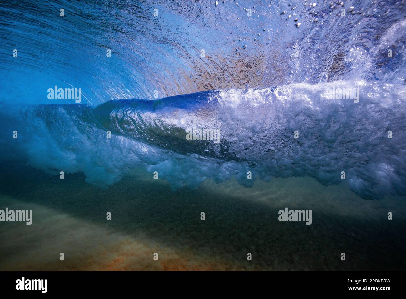 Crystal clear wave twist shot from below the surface in Maui, Hawaii ...