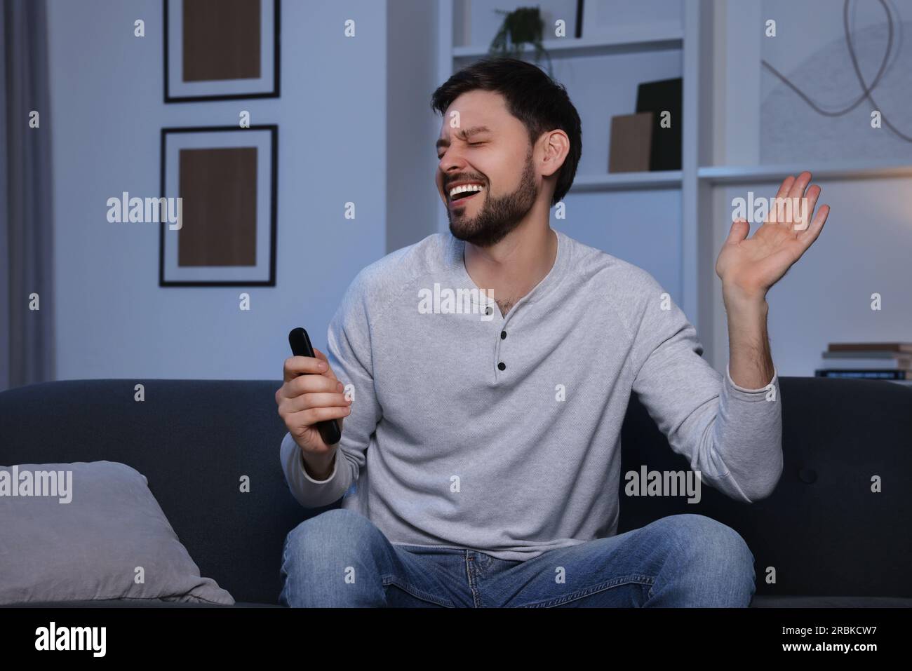 Man with remote controller hi-res stock photography and images - Alamy