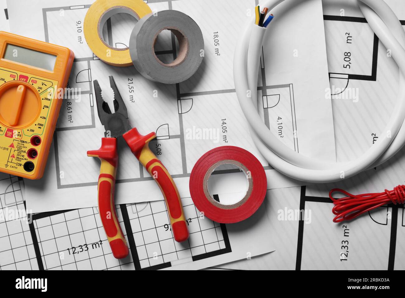 Different wires and tools on electrical schemes, top view Stock Photo ...