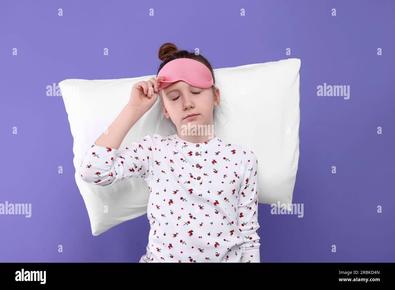 Girl with sleep mask and pillow on purple background. Insomnia problem ...