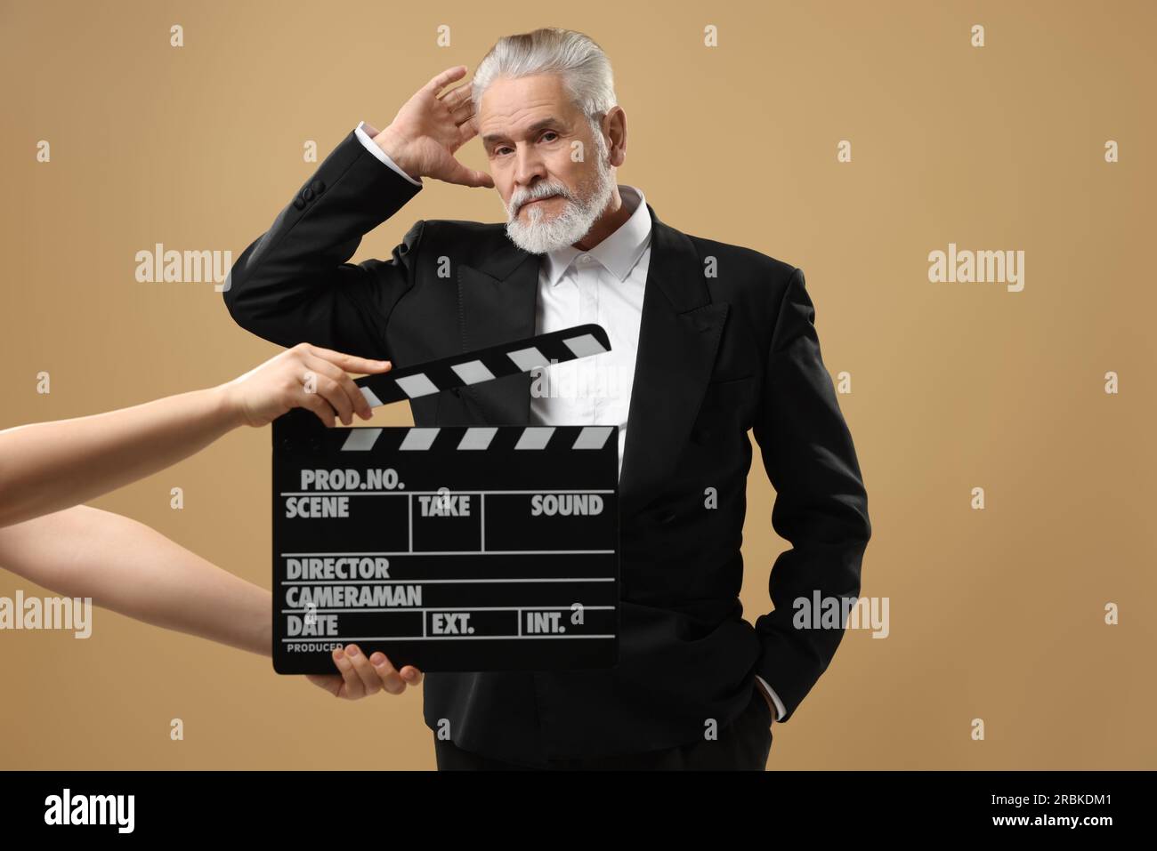 Senior actor performing role while second assistant camera holding ...